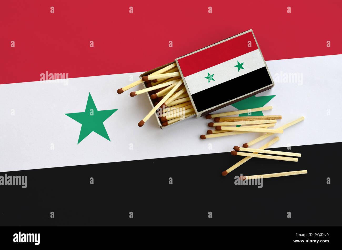 Syria flag is shown on an open matchbox hi-res stock photography and ...
