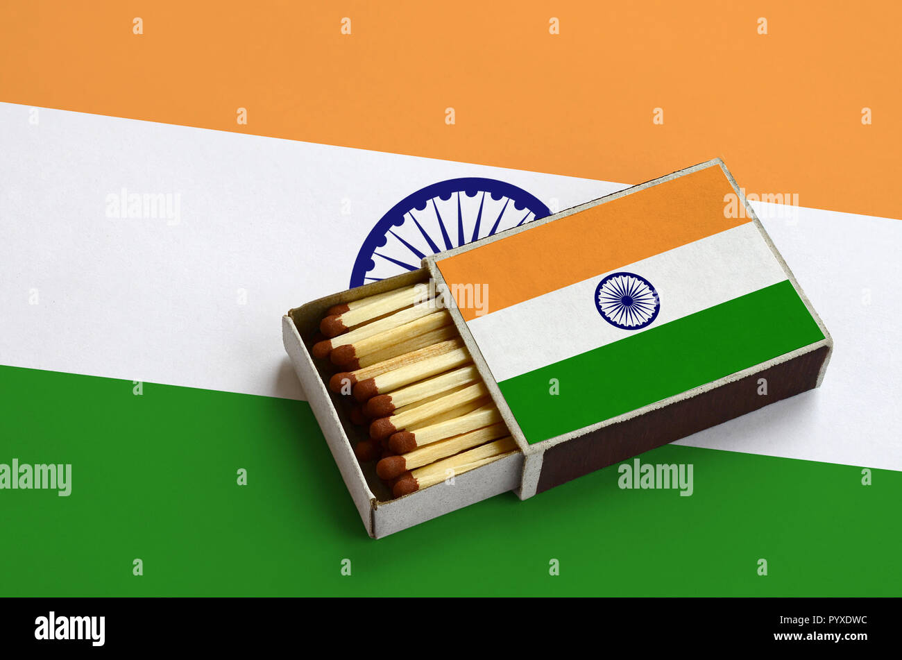 India flag is shown in an open matchbox, which is filled with matches ...