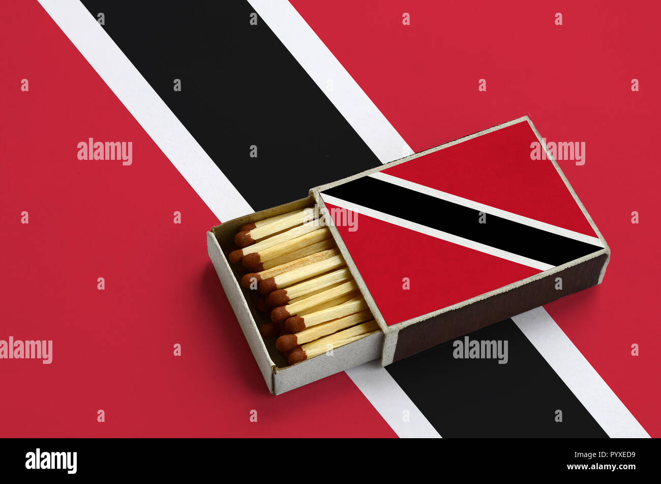 Trinidad and Tobago flag is shown in an open matchbox, which is filled ...