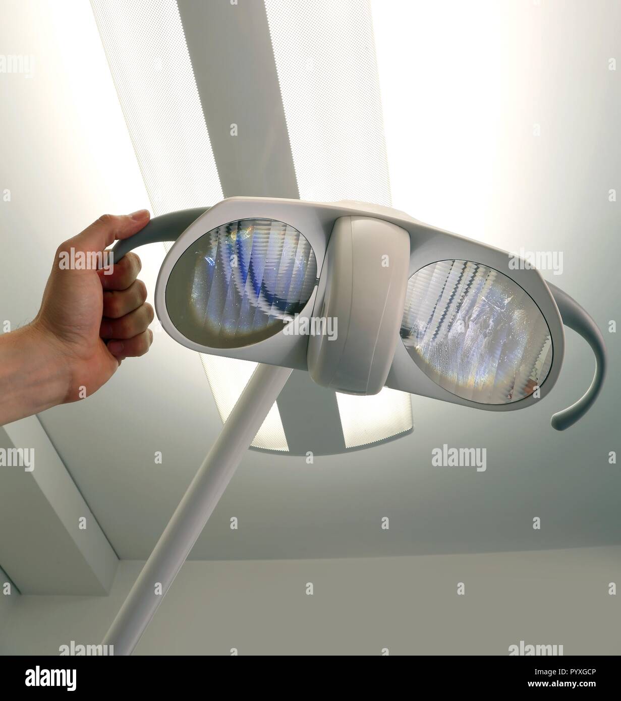 hand of a doctor on a lamp in a dental clinic Stock Photo - Alamy
