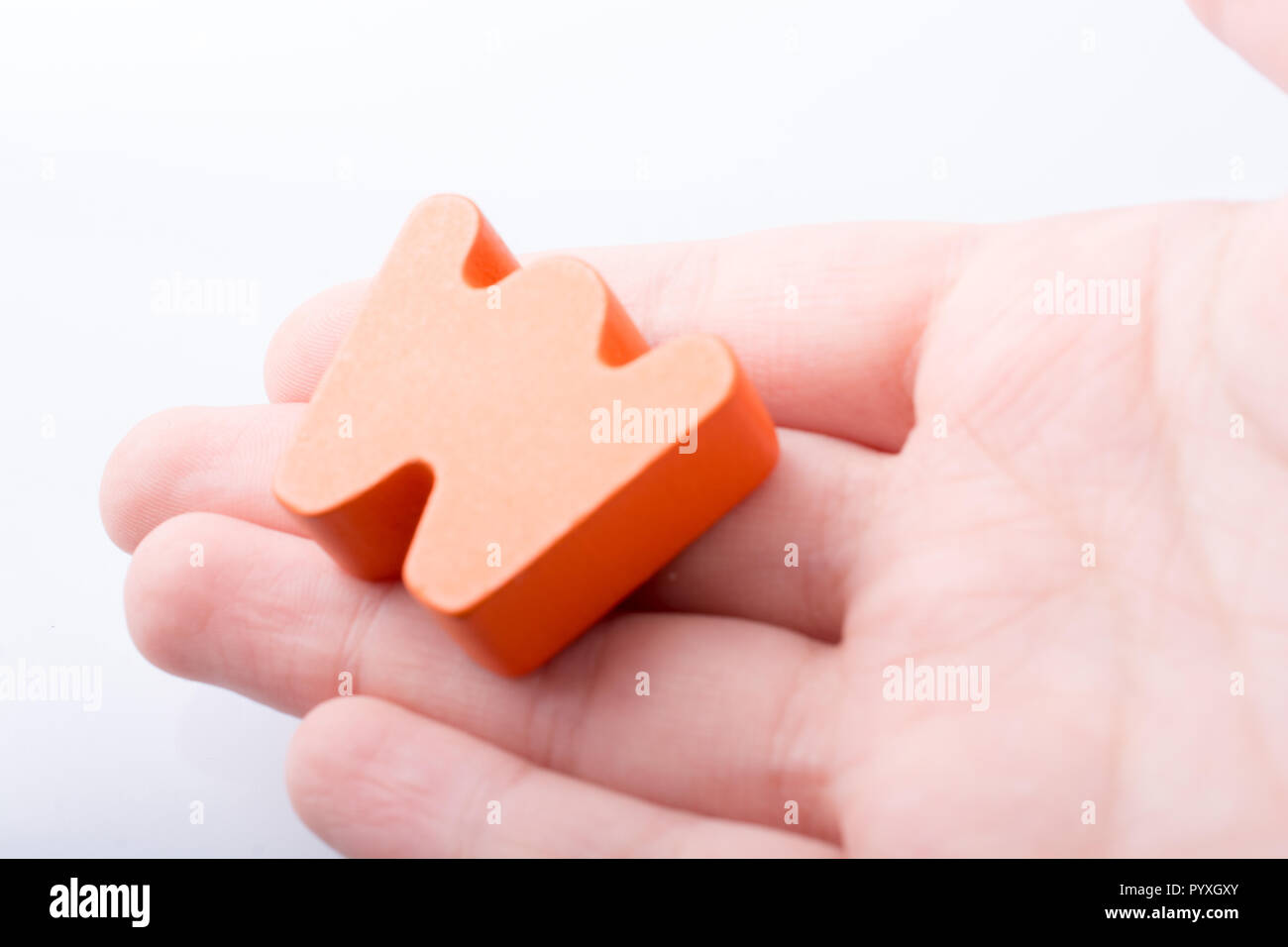 Hand holding letter cube W of made of wood Stock Photo - Alamy