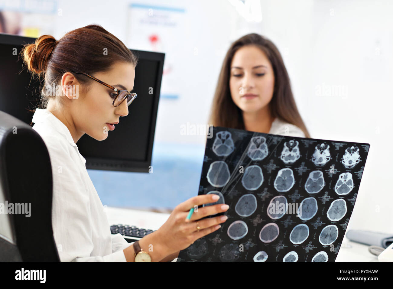 Picture of adult woman having a visit at female doctor's office Stock ...