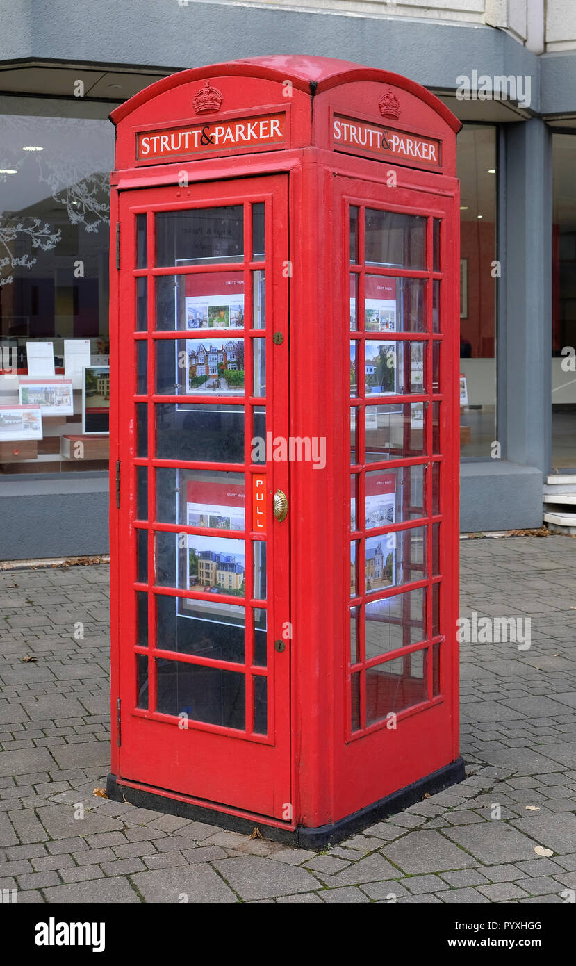 novelty british red telephone box used as estate agents display Stock ...