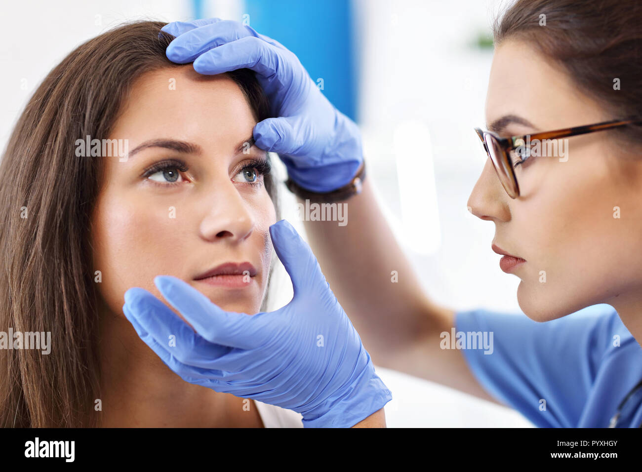 Picture of adult woman having a visit at female doctor's office Stock ...