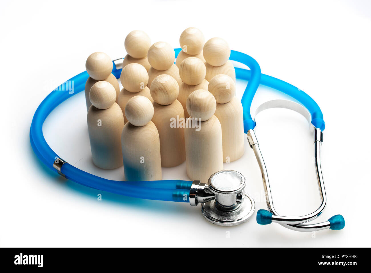 Wooden figures of people and a stethoscope on a white background Stock ...