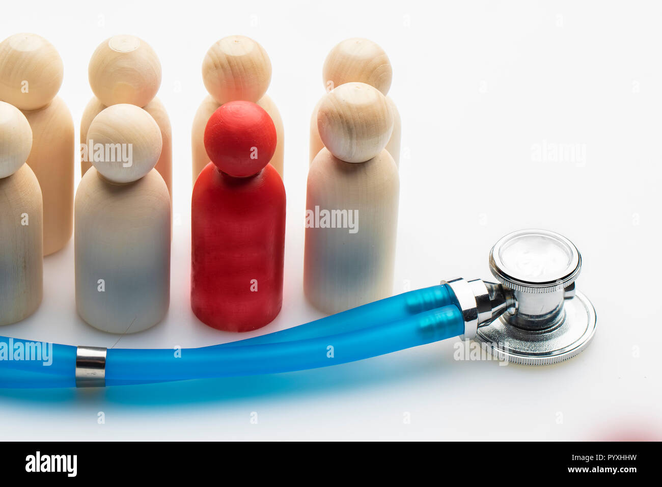 Wooden figures of people and a stethoscope on a white background Stock ...