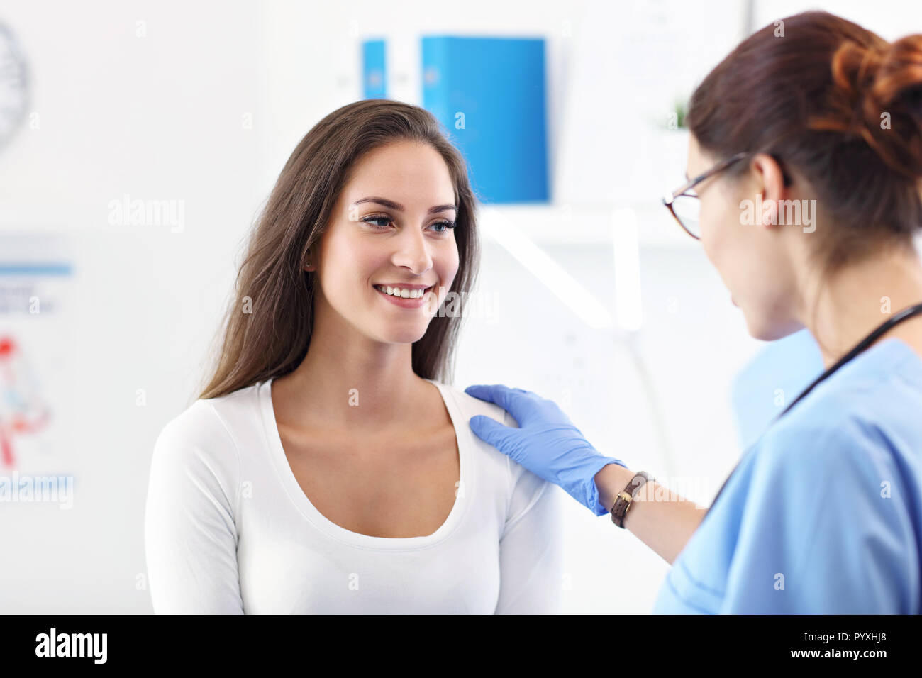 Picture of adult woman having a visit at female doctor's office Stock ...