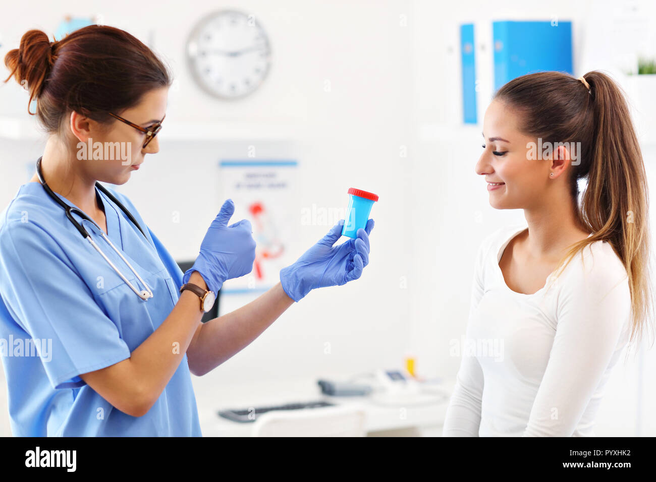 Picture of adult woman having a visit at female doctor's office Stock ...
