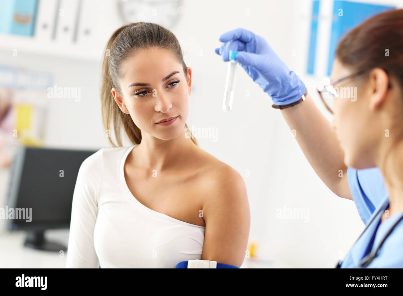 Picture of adult woman having a visit at female doctor's office Stock ...