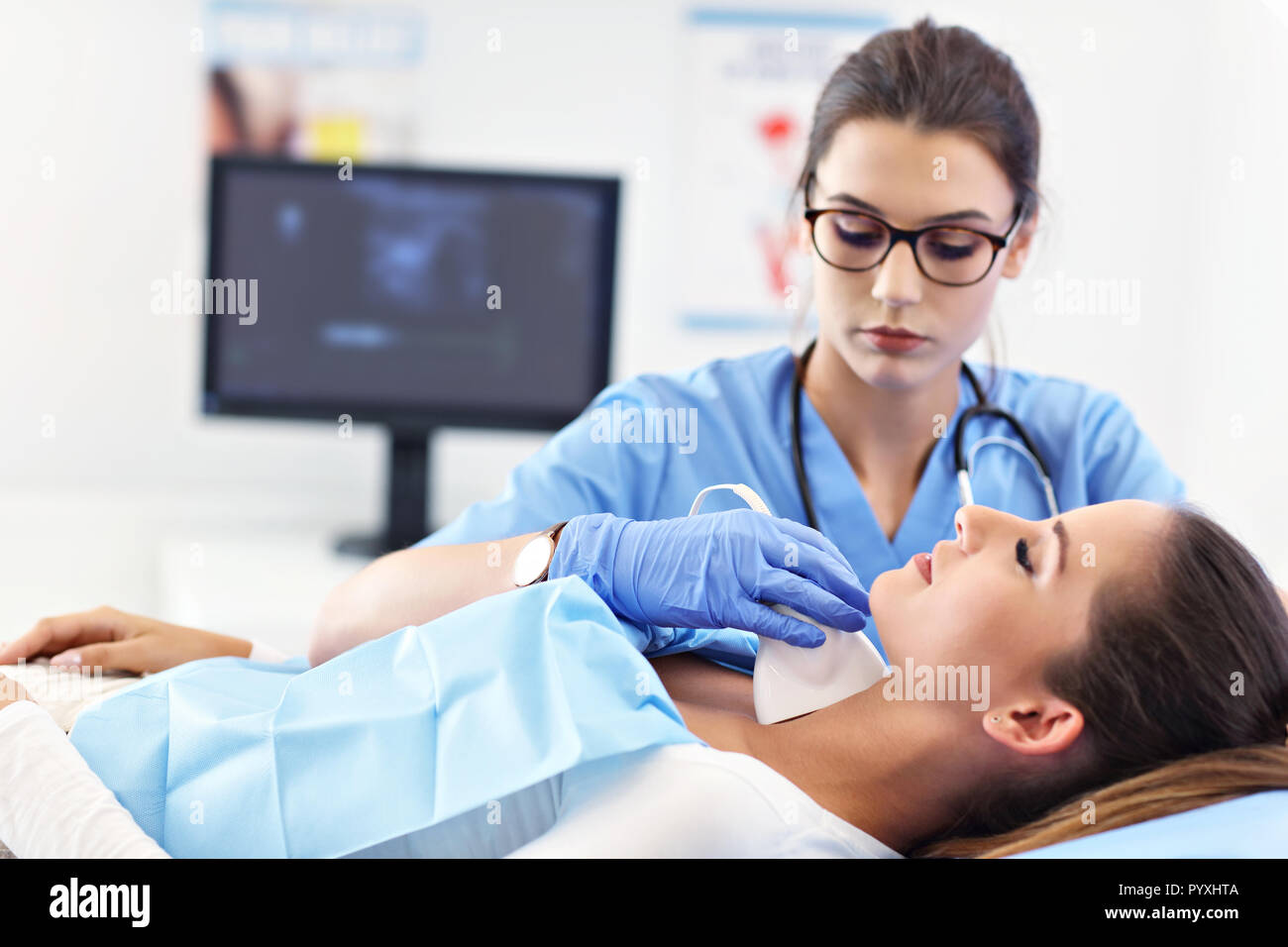 Picture of adult woman having a visit at female doctor's office Stock ...