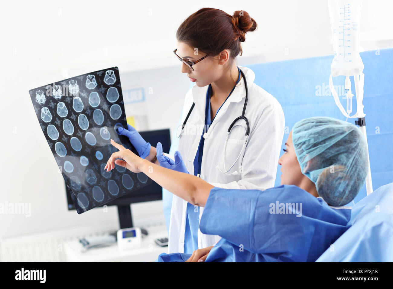 Picture of adult woman having a conversation with doctor in hospital ...