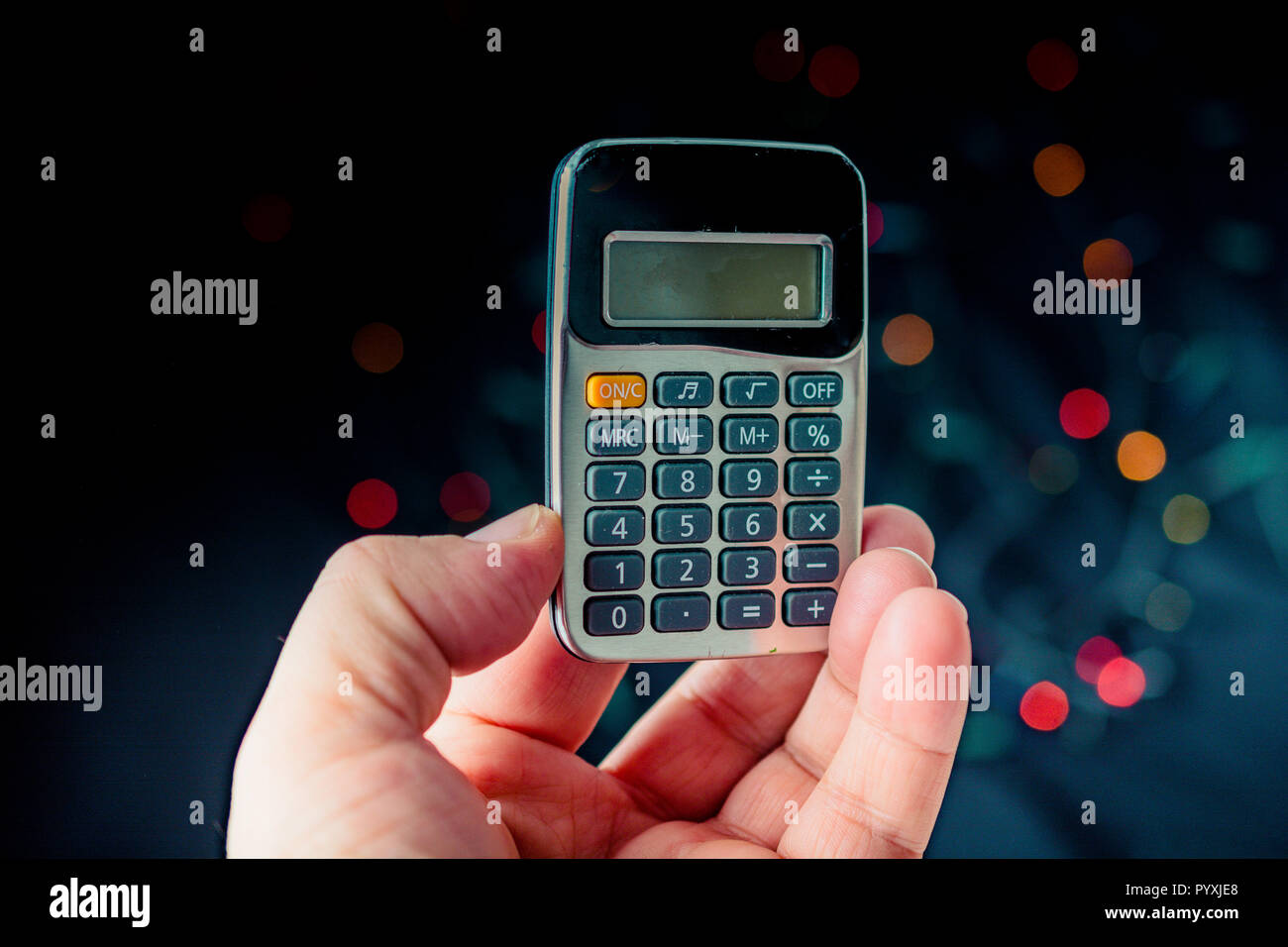 Electronic calculator device with keyboard and display in hand Stock ...