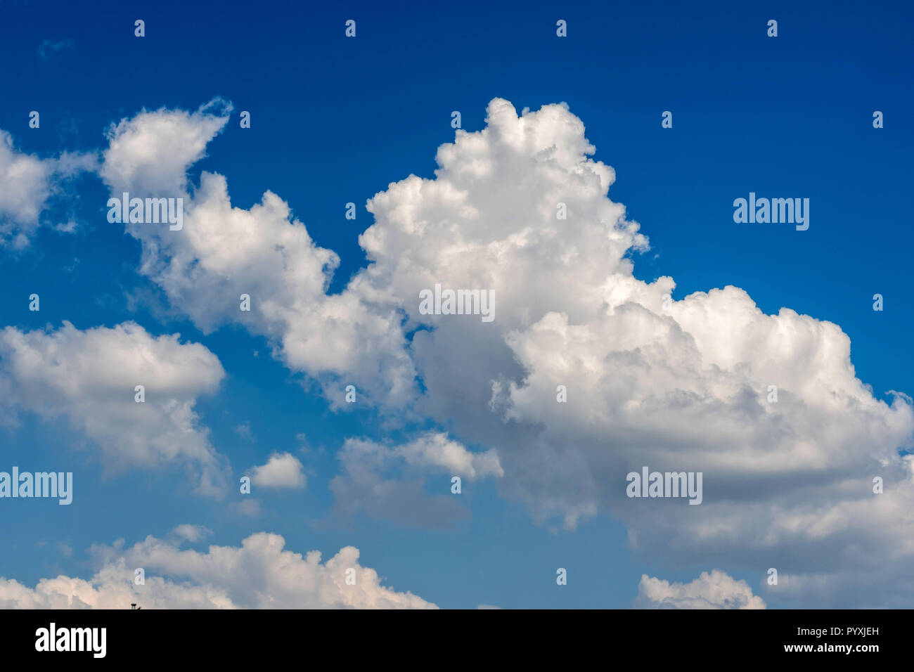 Clouds in the air change shape in many Stock Photo - Alamy