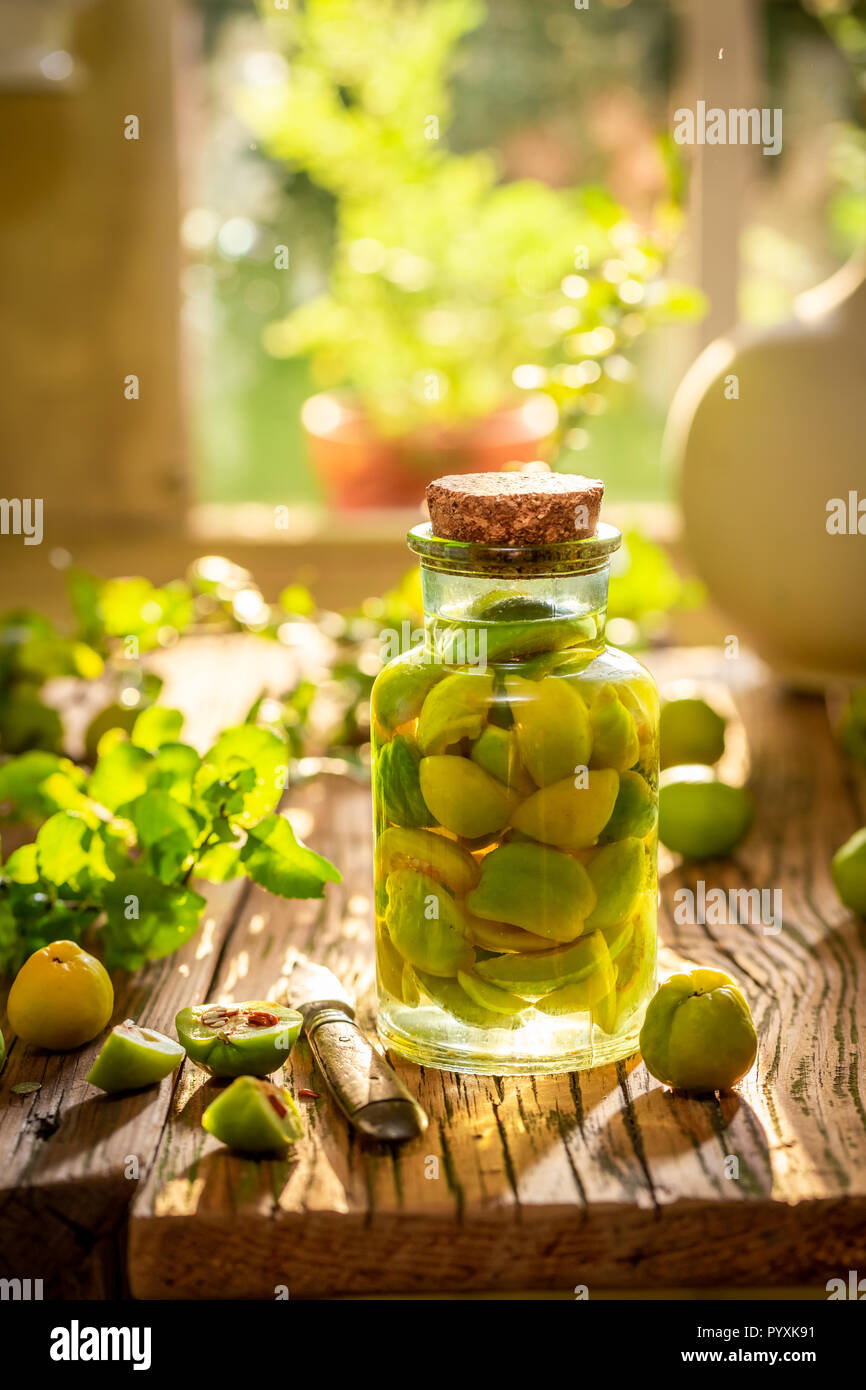 Fresh quince tincture made of fruits and alcohol Stock Photo - Alamy