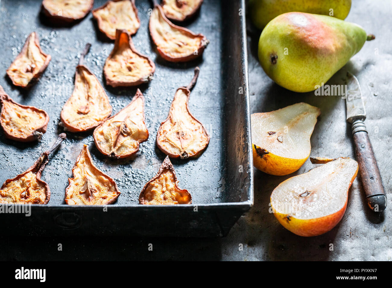 Enjoy your sun dried pears made of fresh fruits Stock Photo - Alamy