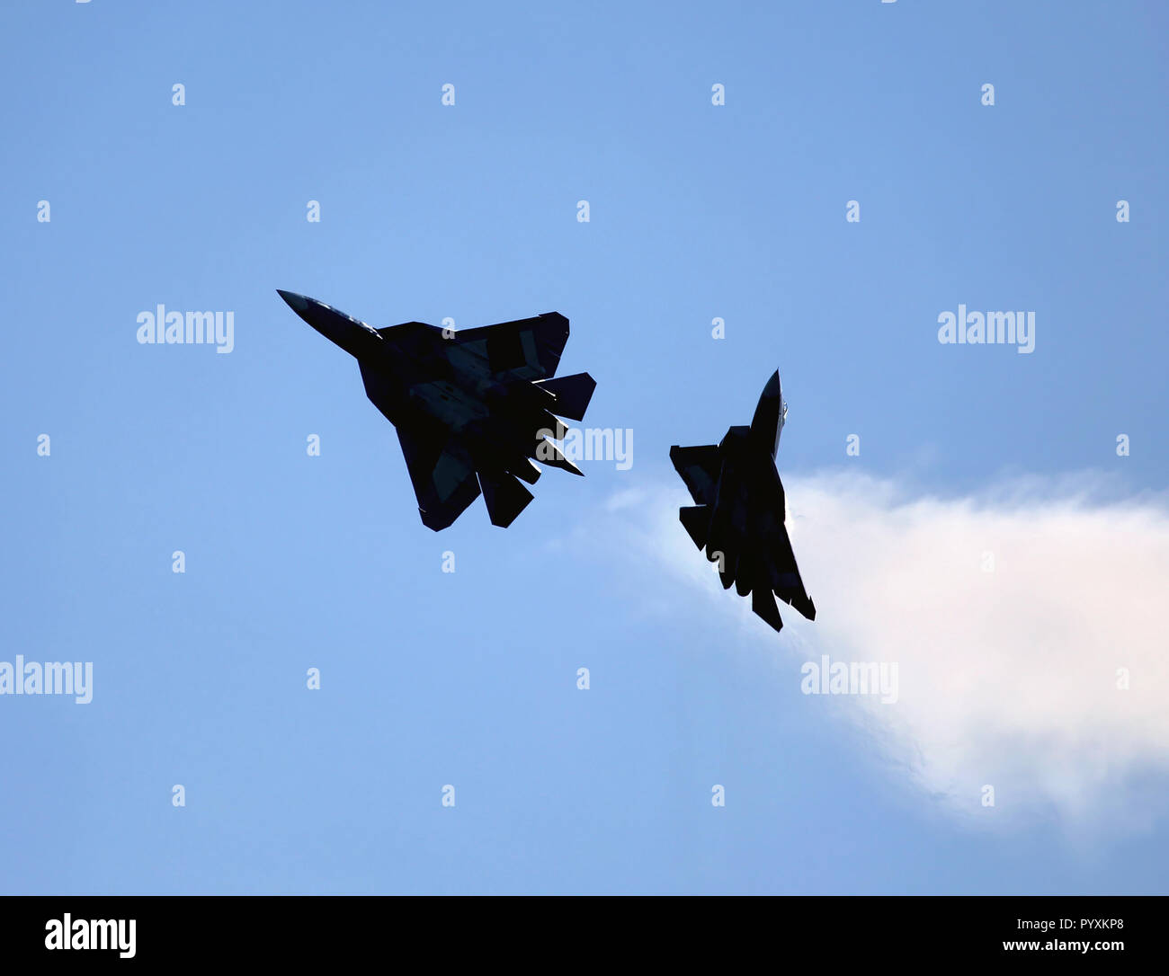 Fighters make maneuver during close air combat Stock Photo - Alamy