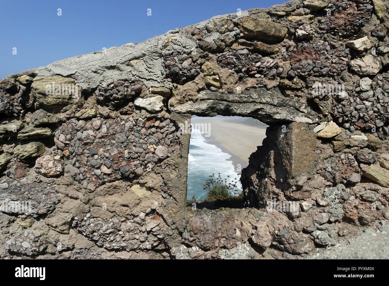 lighthouse in the small village of nazare in portugal Stock Photo - Alamy