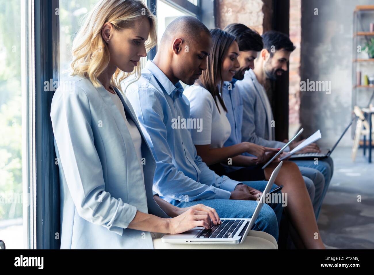 Really good info. Group of young people sitting on conference together ...