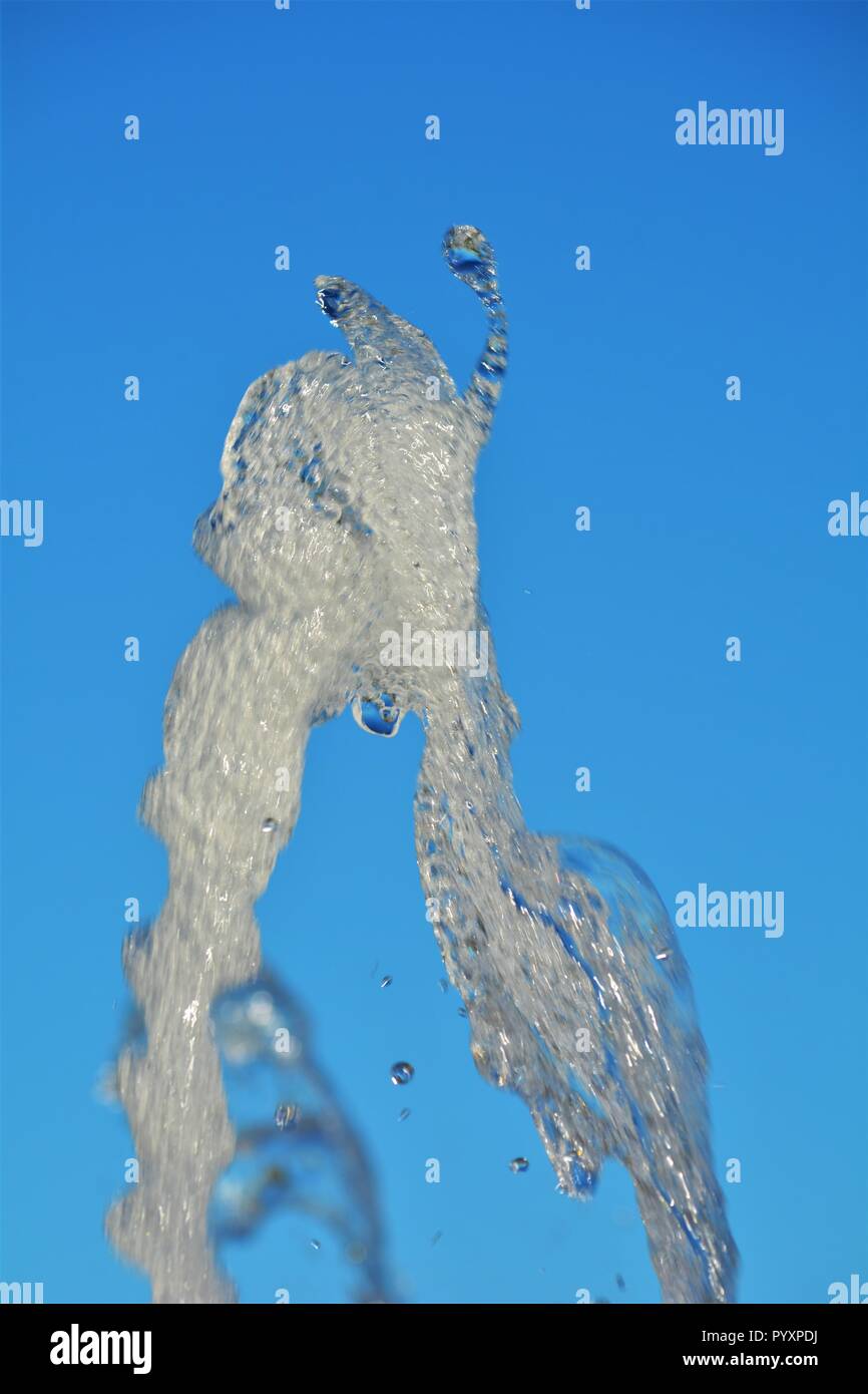 abstract water shapes from fountain Stock Photo - Alamy