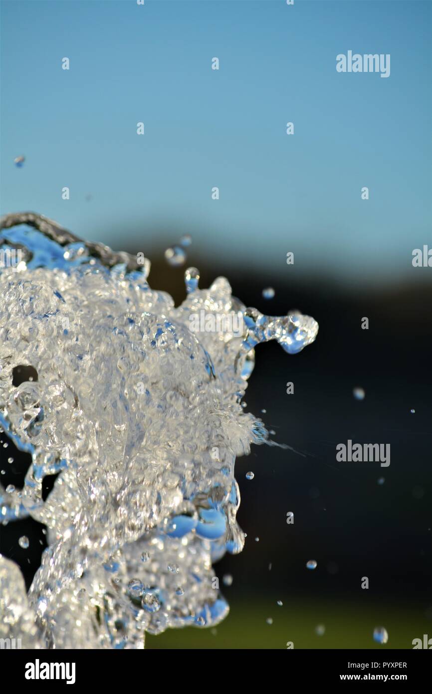 abstract water shapes from fountain Stock Photo - Alamy
