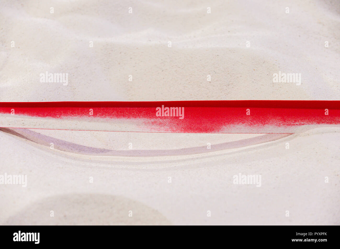beach volleyball court up close and in detail with red plastic line ...