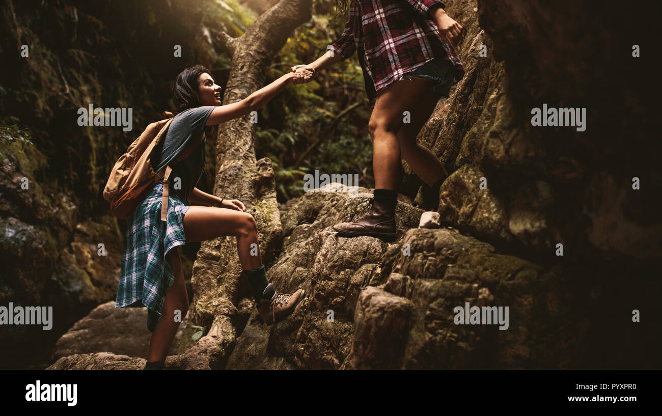 Helping hand mountain climbing hi-res stock photography and images - Alamy