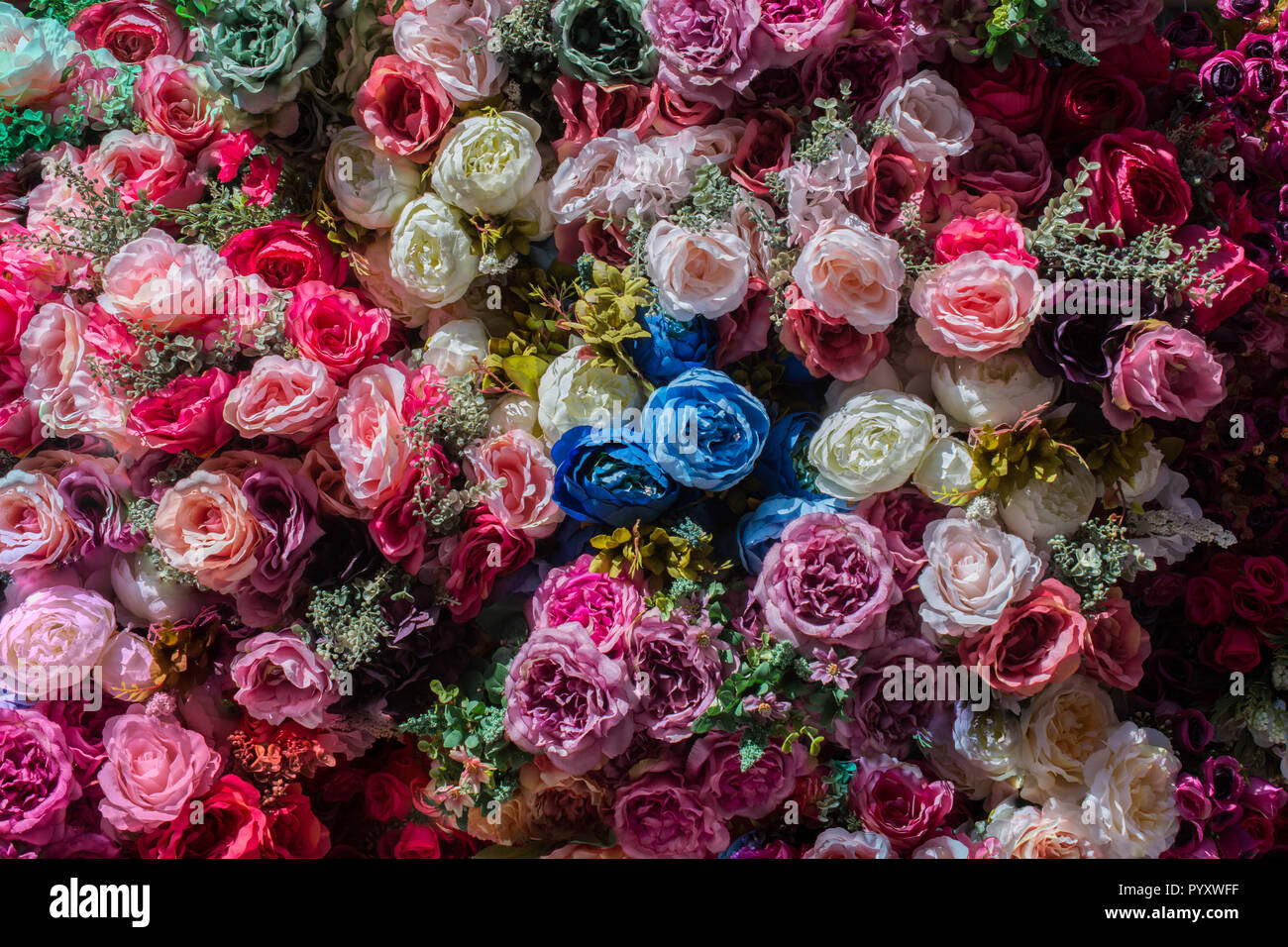 Floral art made of colorful artificial flowers in view Stock Photo - Alamy