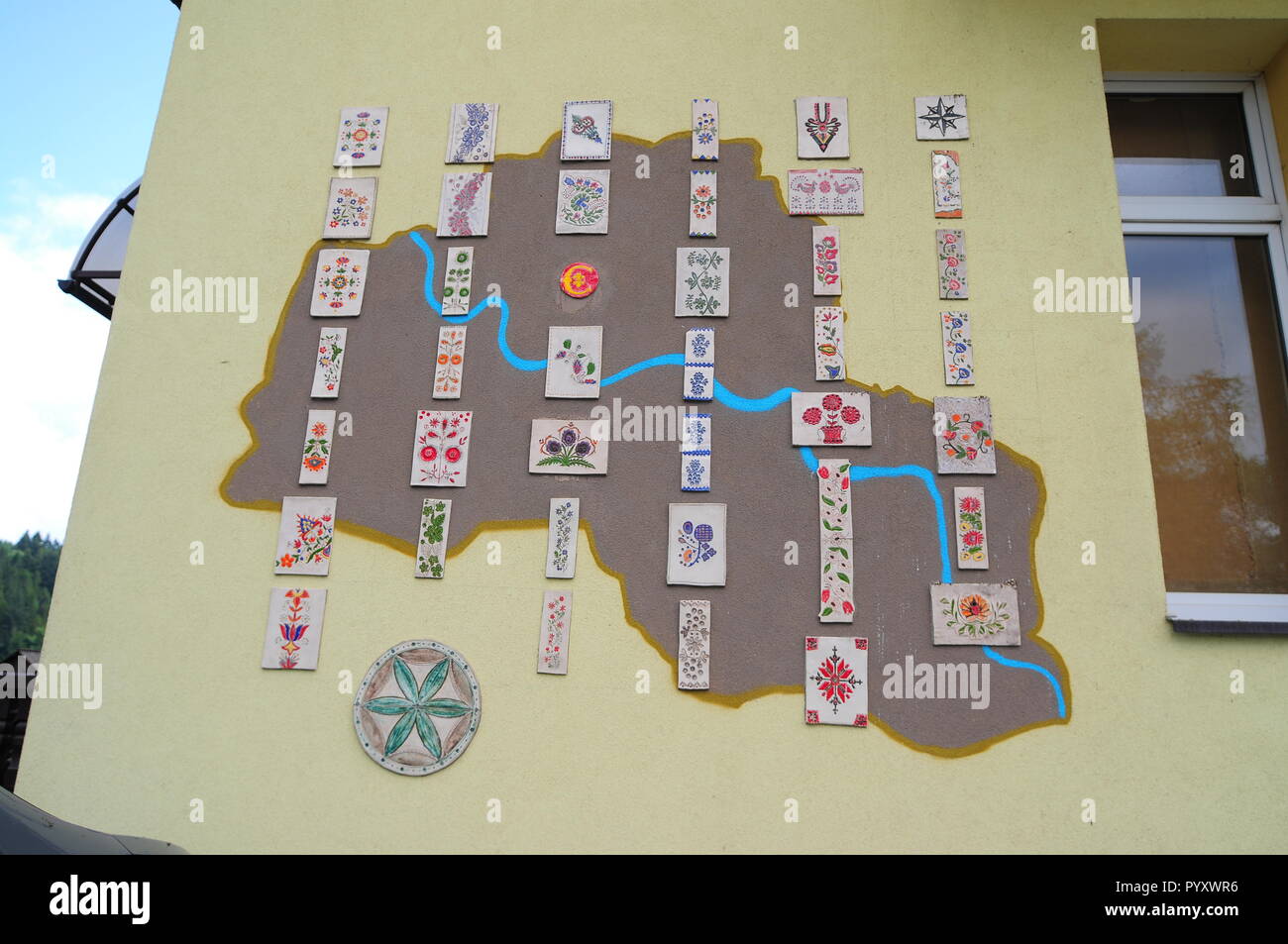 Cisna, Poland, July 2018. Symbols on the wall of the museum in Cisna ...