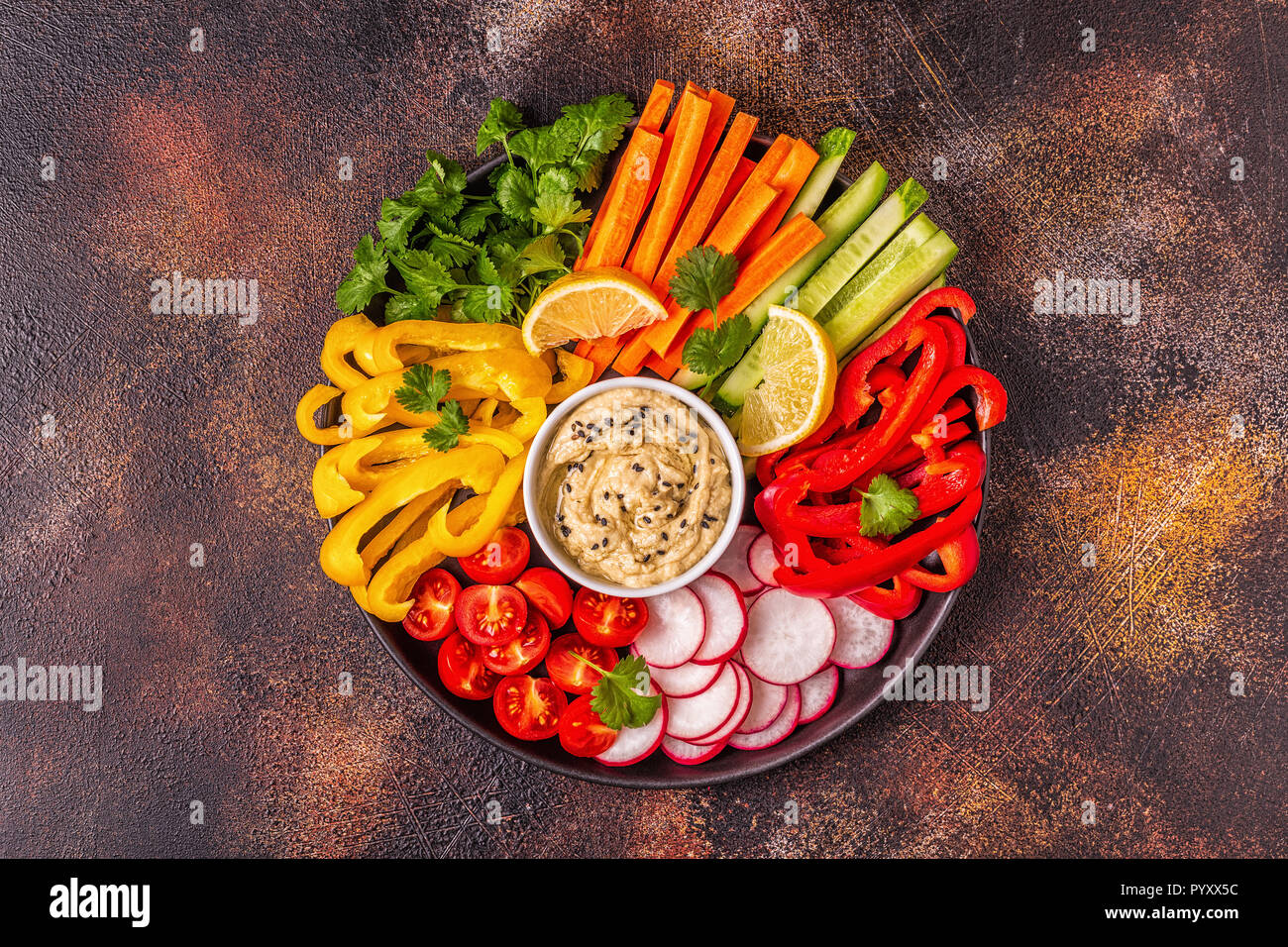 Homemade hummus with fresh vegetables, top view Stock Photo - Alamy
