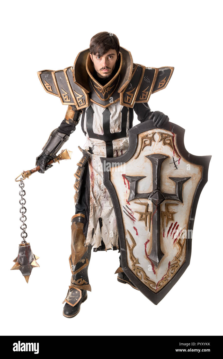 Young man cosplaying with fantasy knight costume Stock Photo - Alamy