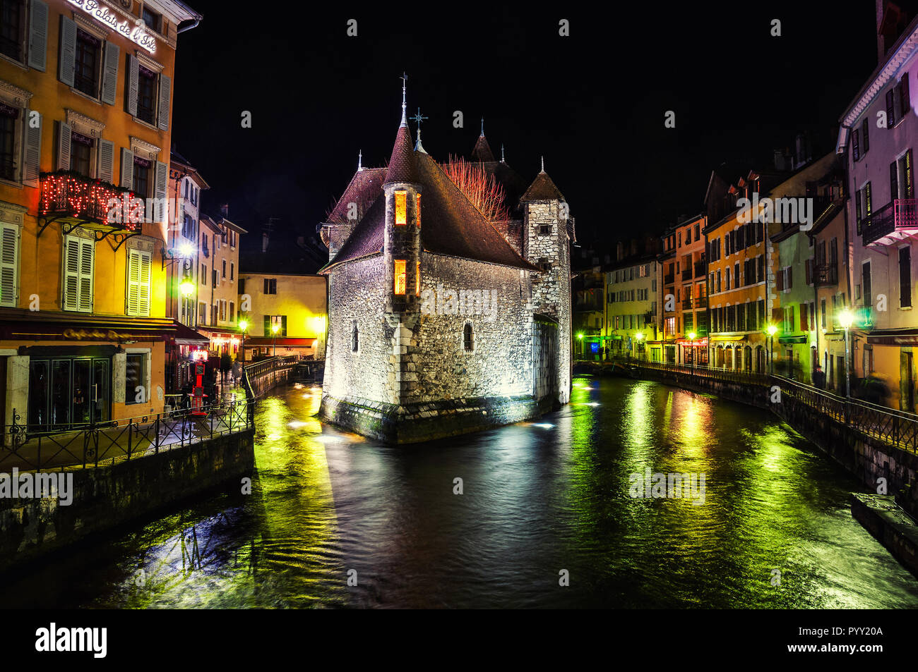 The Palais de l'Isle and Thiou river in Annecy, France at night ...