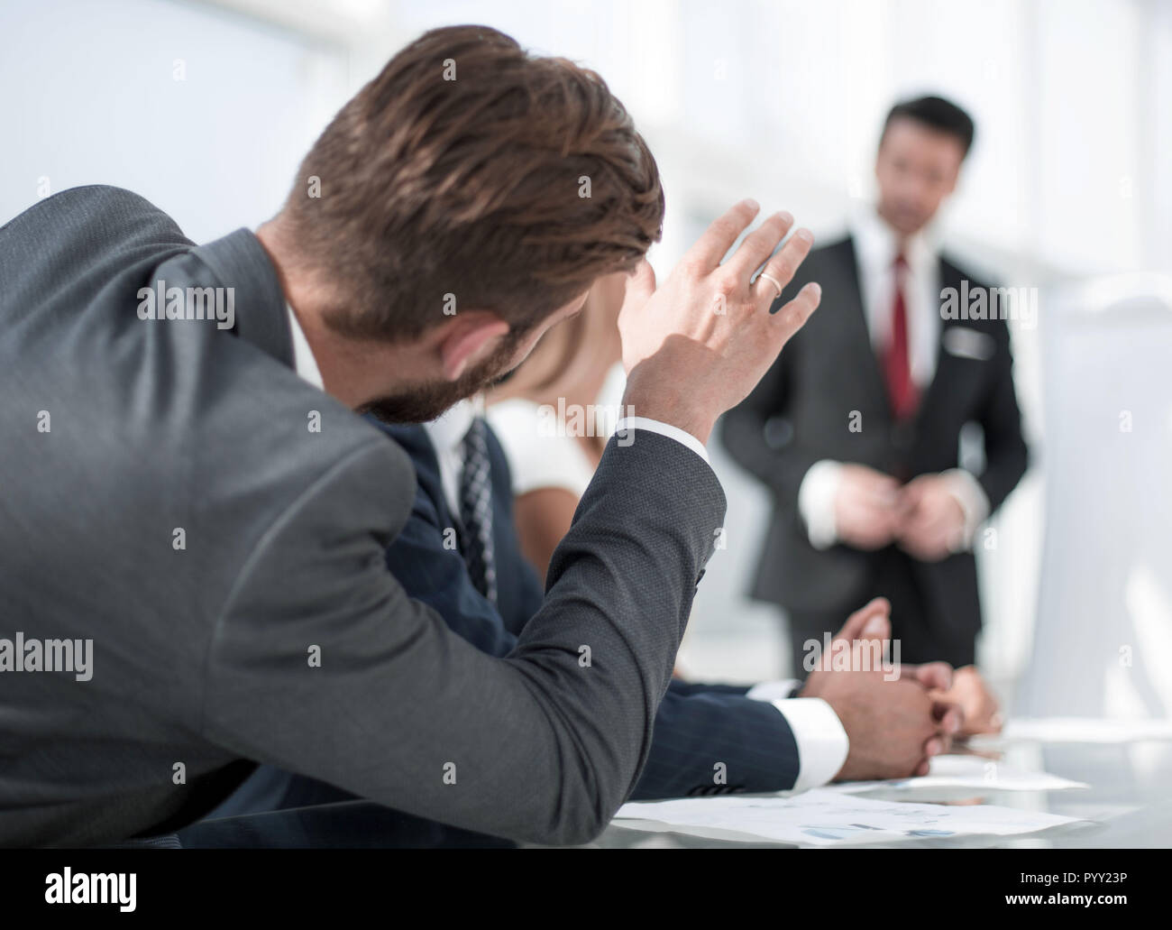 employee asks a question at a business presentation Stock Photo - Alamy