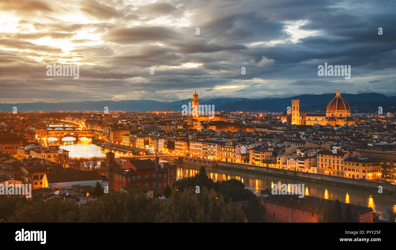 Aerial panoramic view of illuminated Florence, Italy at night. All ...