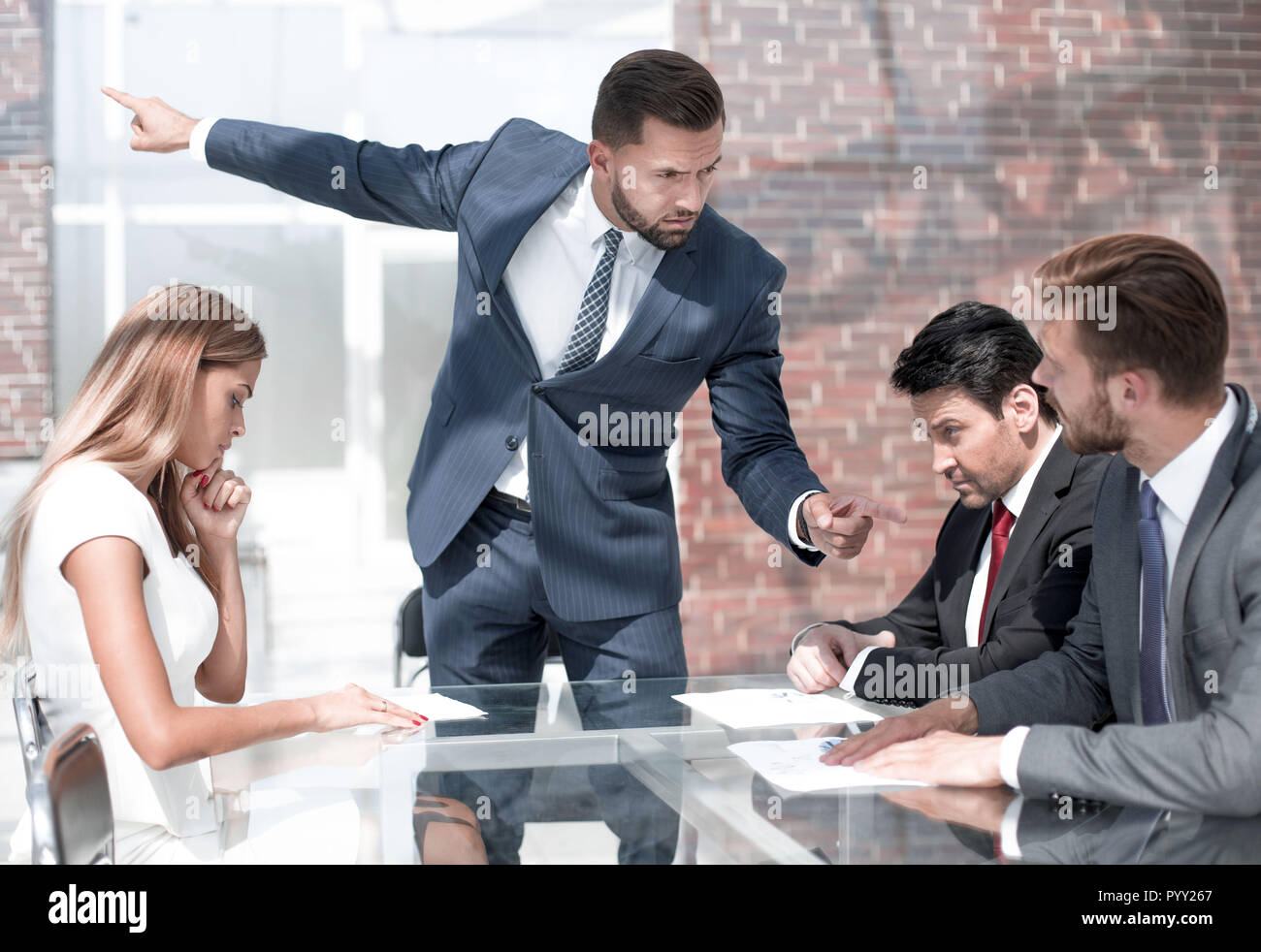 strict boss talking to employees at a business meeting Stock Photo - Alamy strict boss talking to employees at a business meeting Stock Photo - Alamy