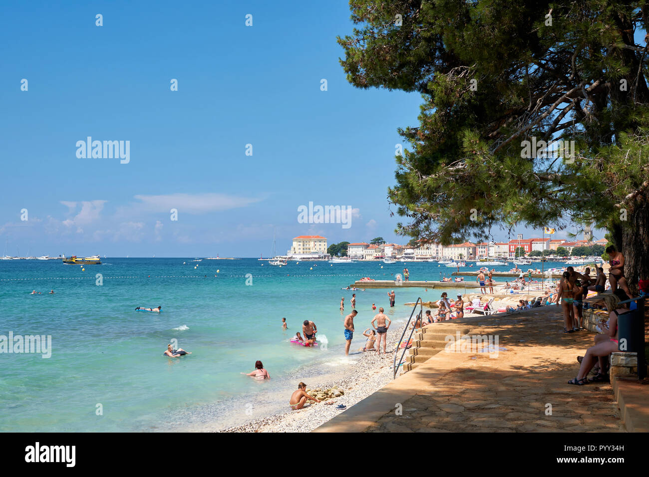 Tourists on the beach in Porec in Croatia Stock Photo - Alamy