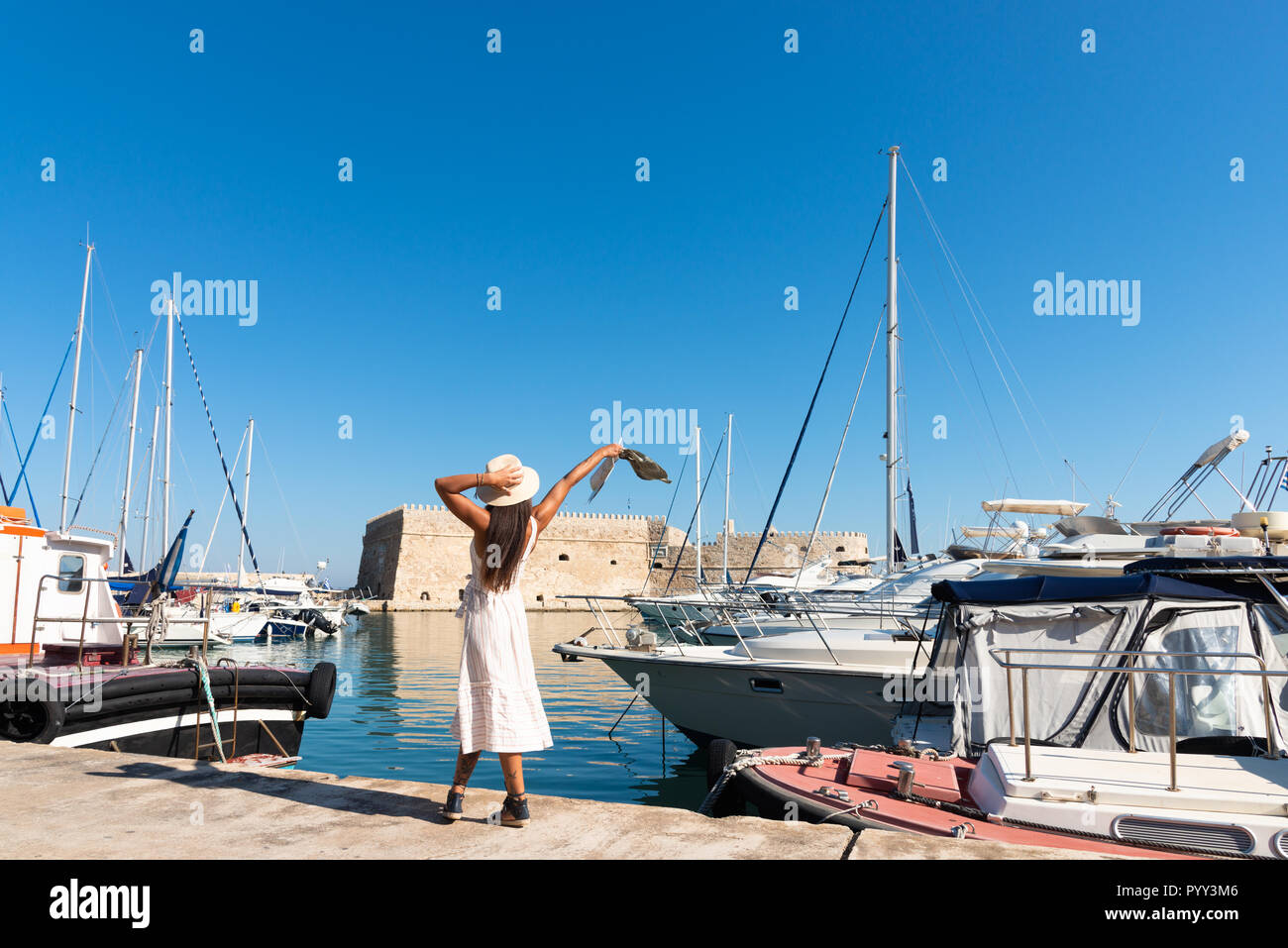 Traveling tourist woman on vacation in Heraklion Crete walking at the ...