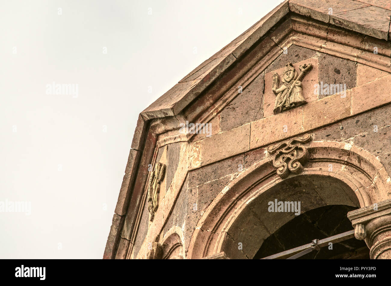 Relief figures of saints under the stone octagonal roof of the bell ...