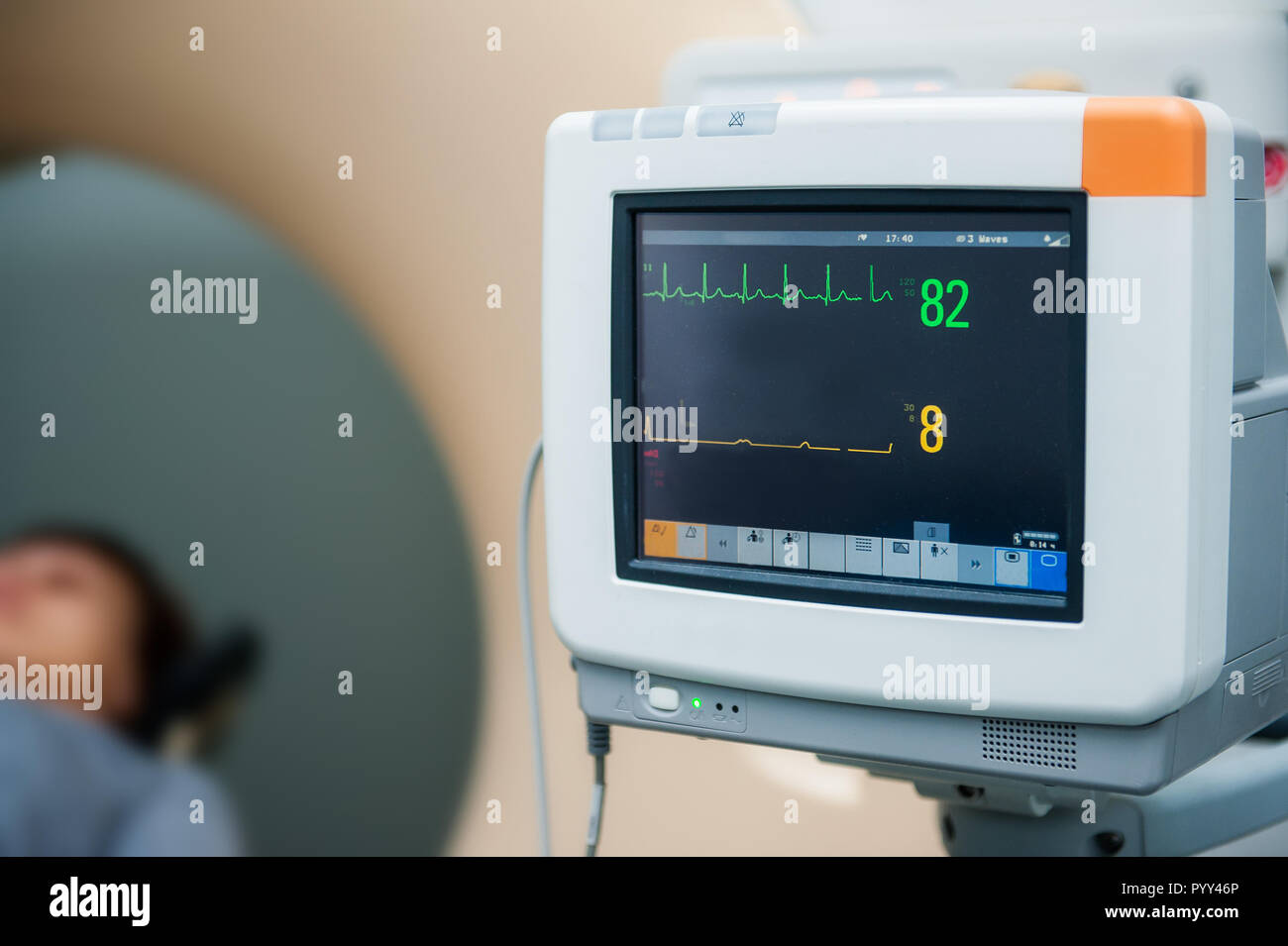 Close up electrocardiograph showing patient heart rate with pacient ...