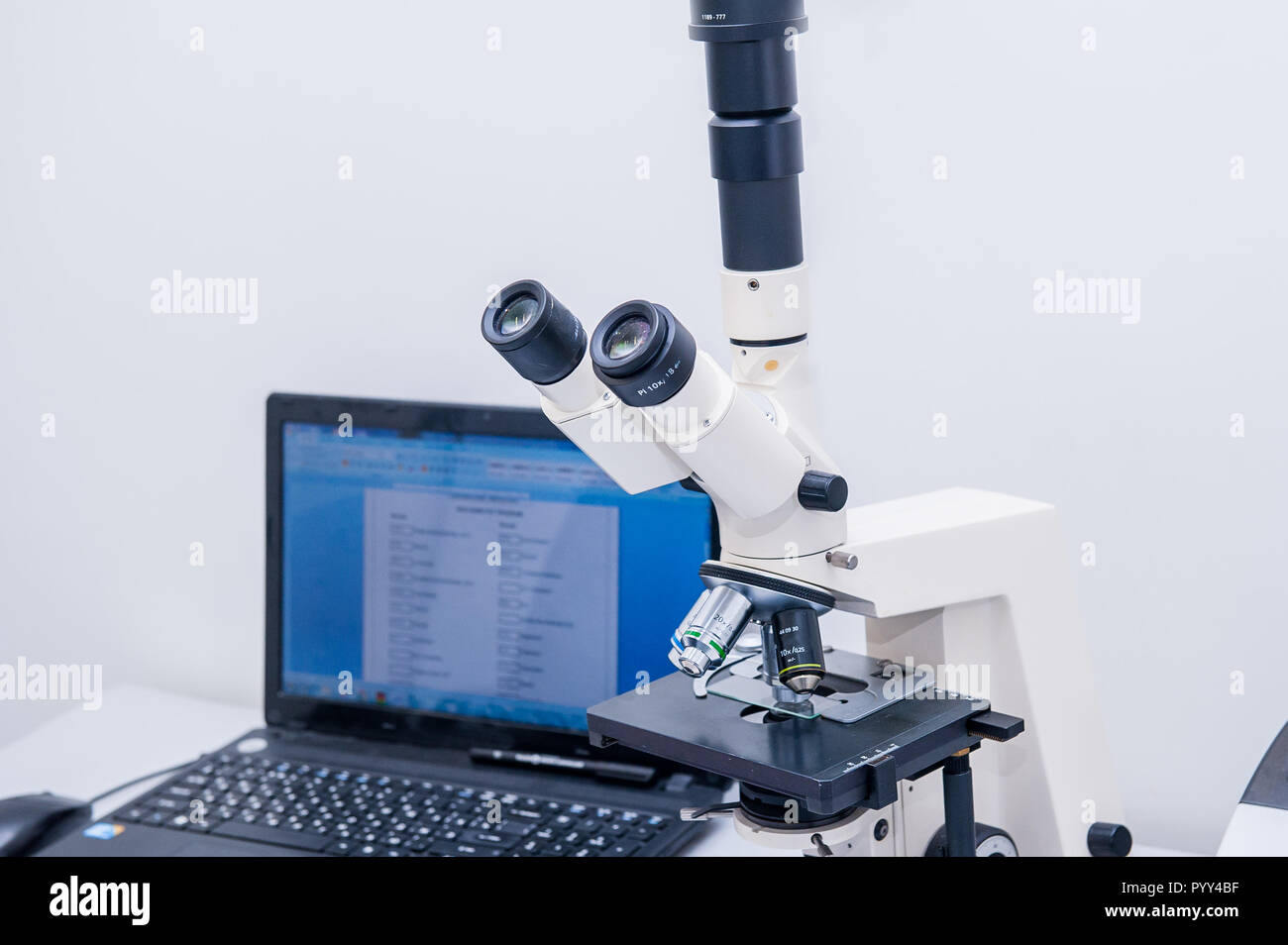 Modern microscope equipped with digital camera and computer in clinic ...
