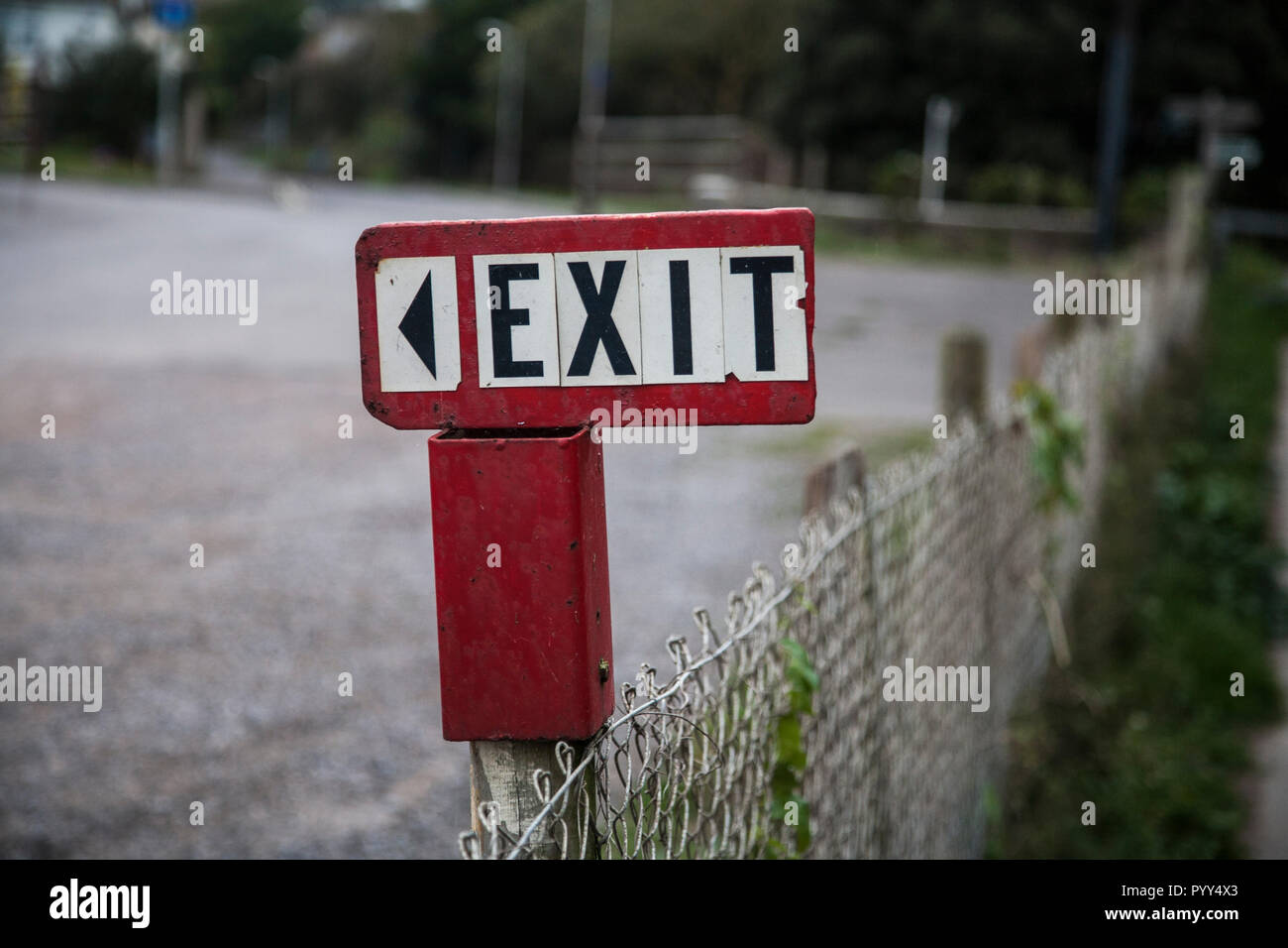 Exit sign, in a carpark, pointing to the left Stock Photo - Alamy