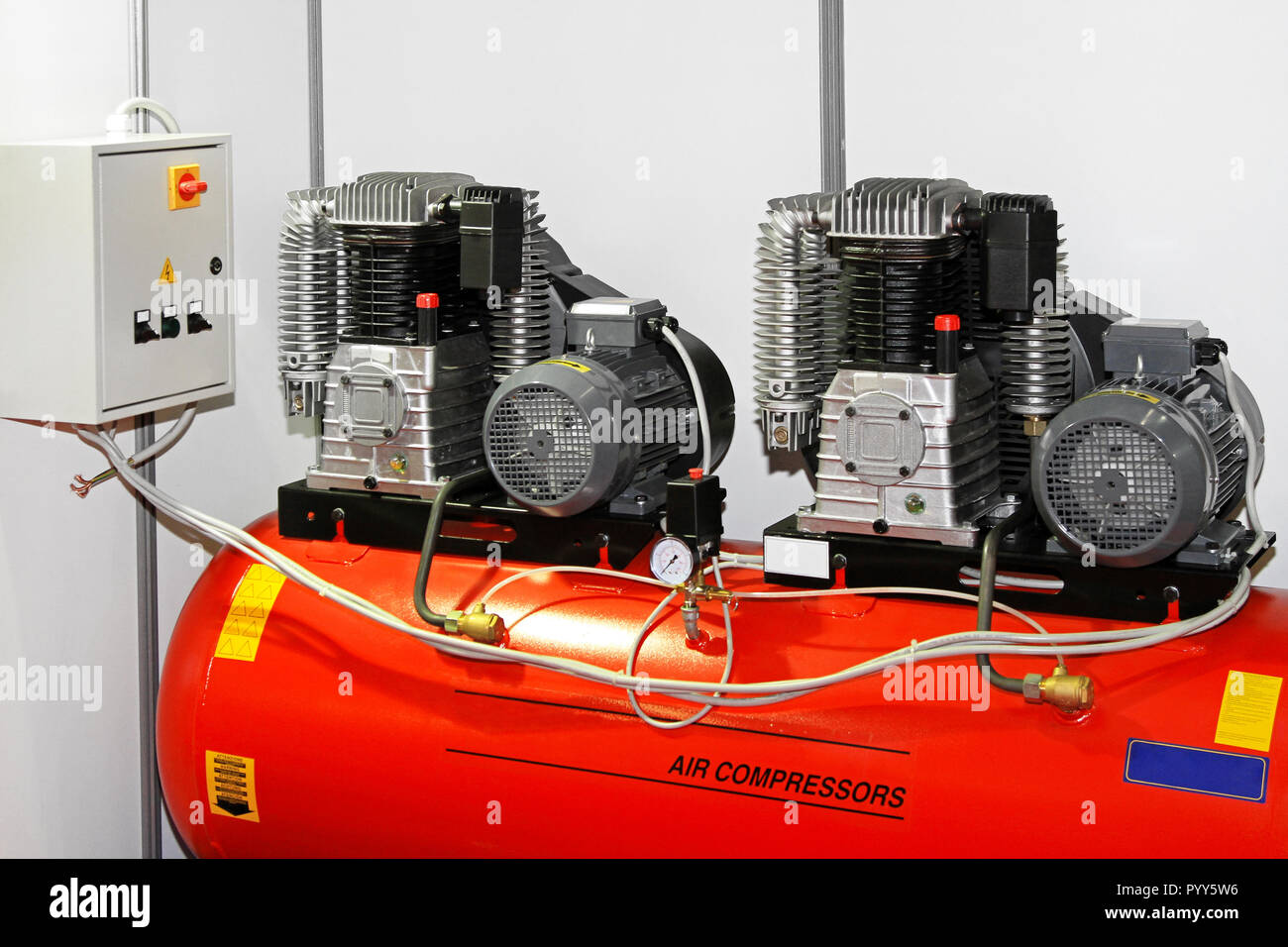 Double engine air compressor in service garage Stock Photo - Alamy