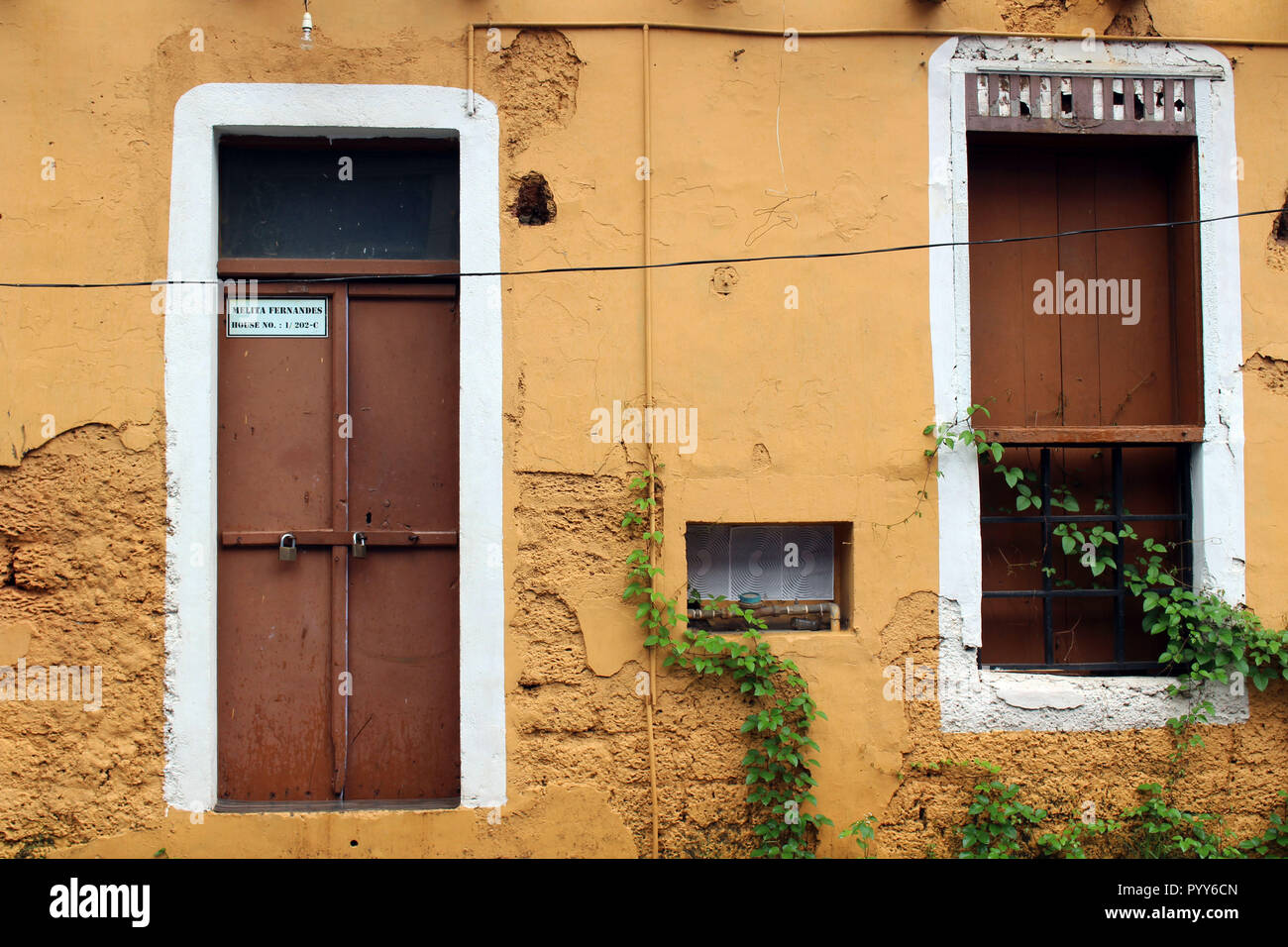 Translation: the yellow vintage and colorful windows and doors in Goa ...