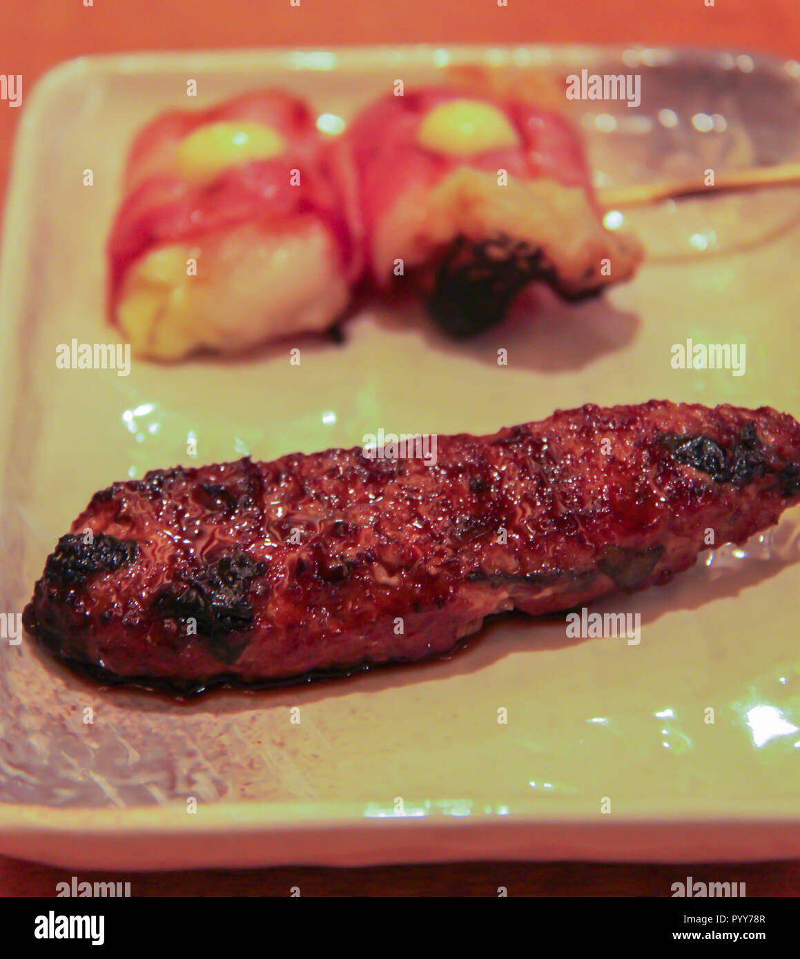 Nice char on a Yakitori skewered meat Stock Photo - Alamy