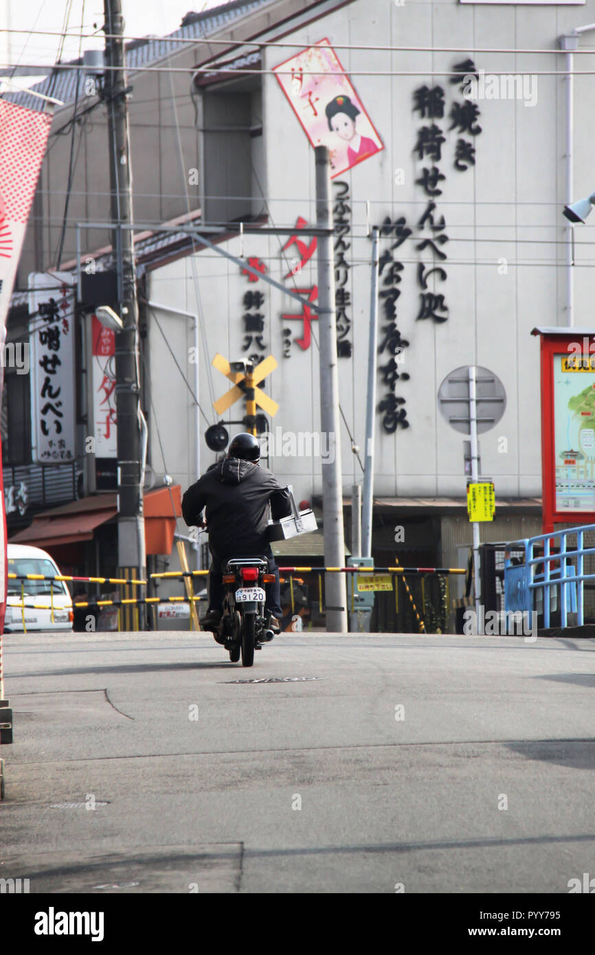 Pizza delivery man motorcycle transport scooter hi-res stock ...