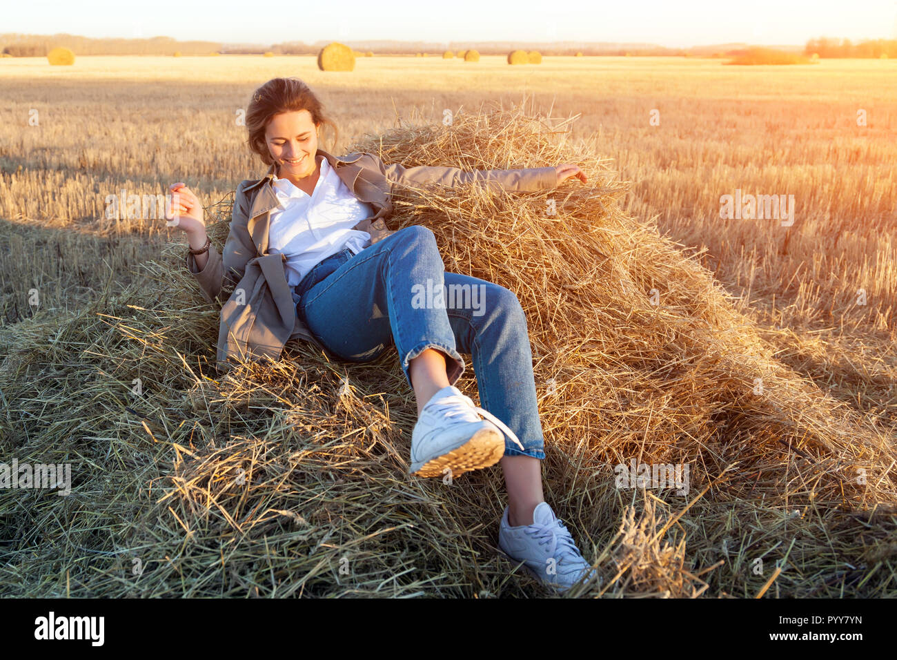 Girl lying on haystack hi-res stock photography and images - Alamy