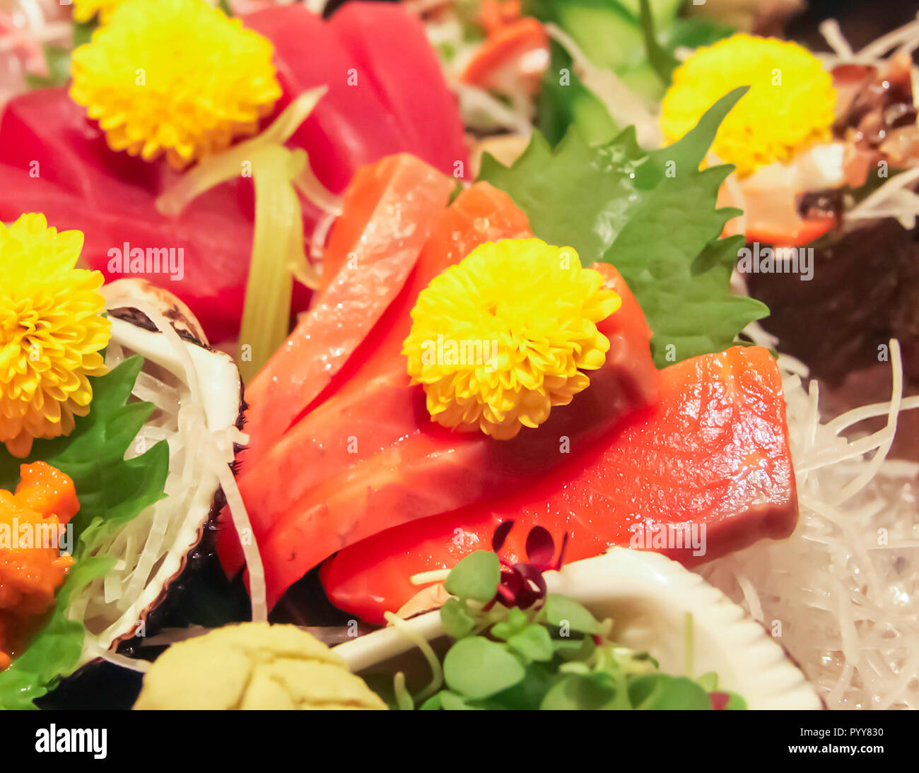 Salmon sashimi slices with flower garnish Stock Photo - Alamy