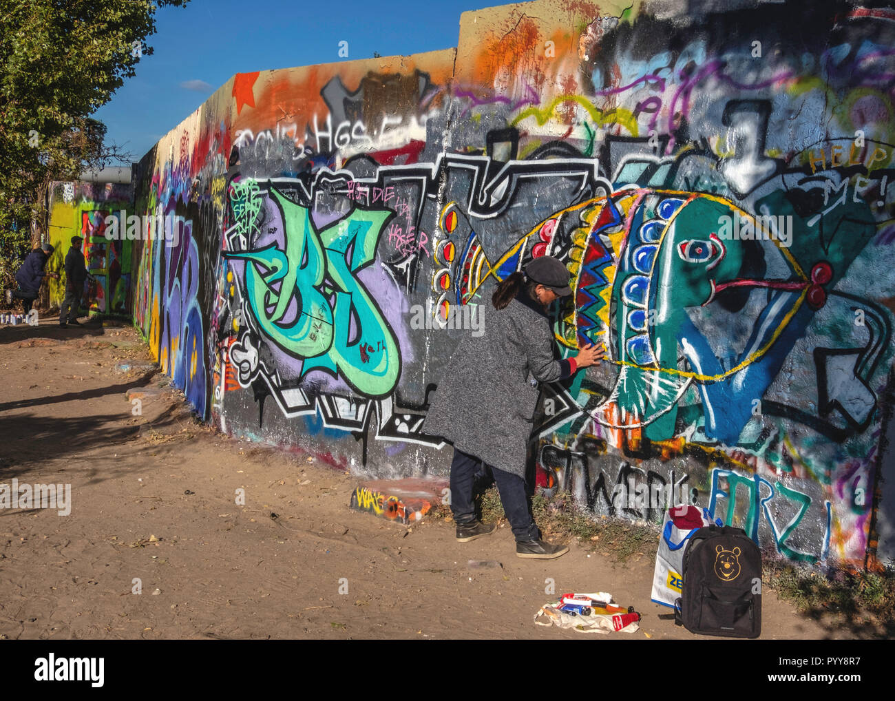 Germany,Berlin,Mauerpark.2018. Street artist at work on the historic ...
