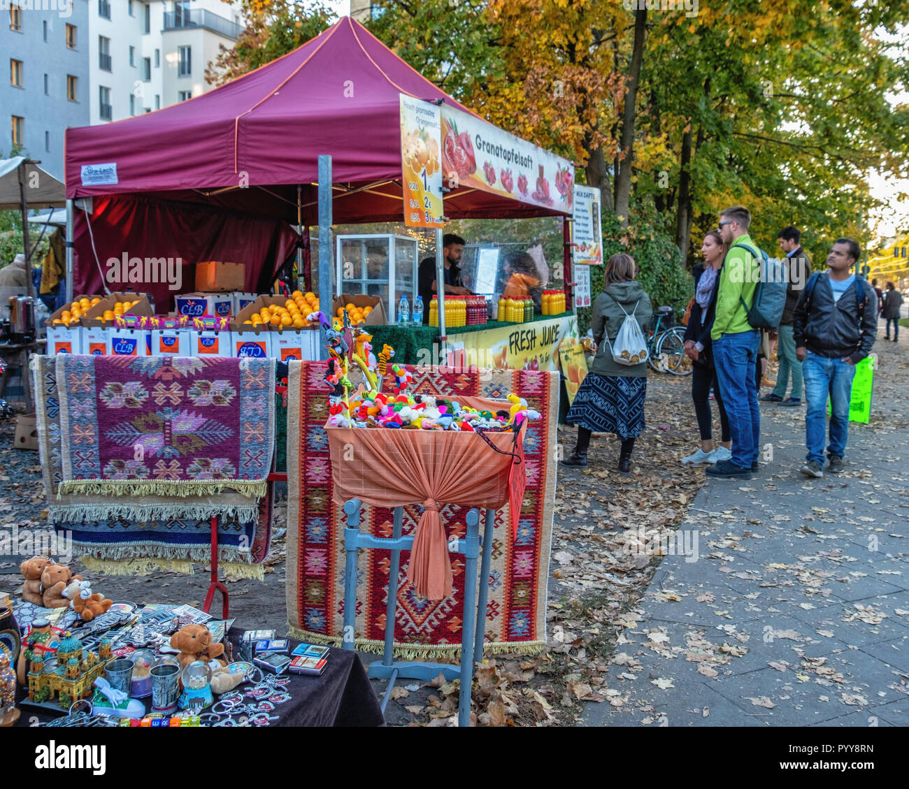 Germany,Berlin,Bernauerstrasse. Fleamarket stalls across the road from ...