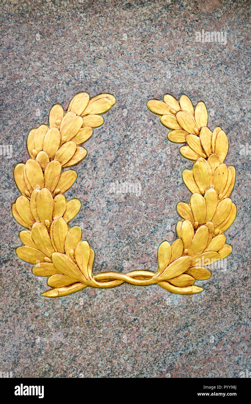 Classic laurel wreath symbol with vintage gold leaf detail in textured ...