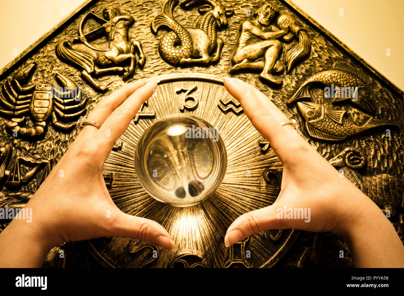 fortune teller hands and magic sphere for divination Stock Photo - Alamy